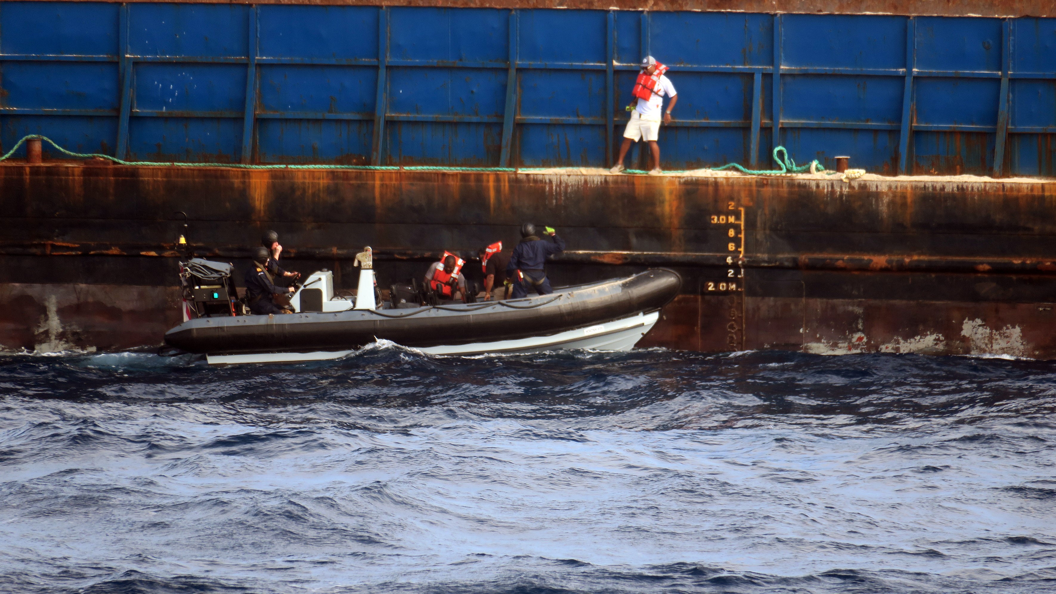 Royal Navy patrol ship rescues crew from sinking tug in Caribbean