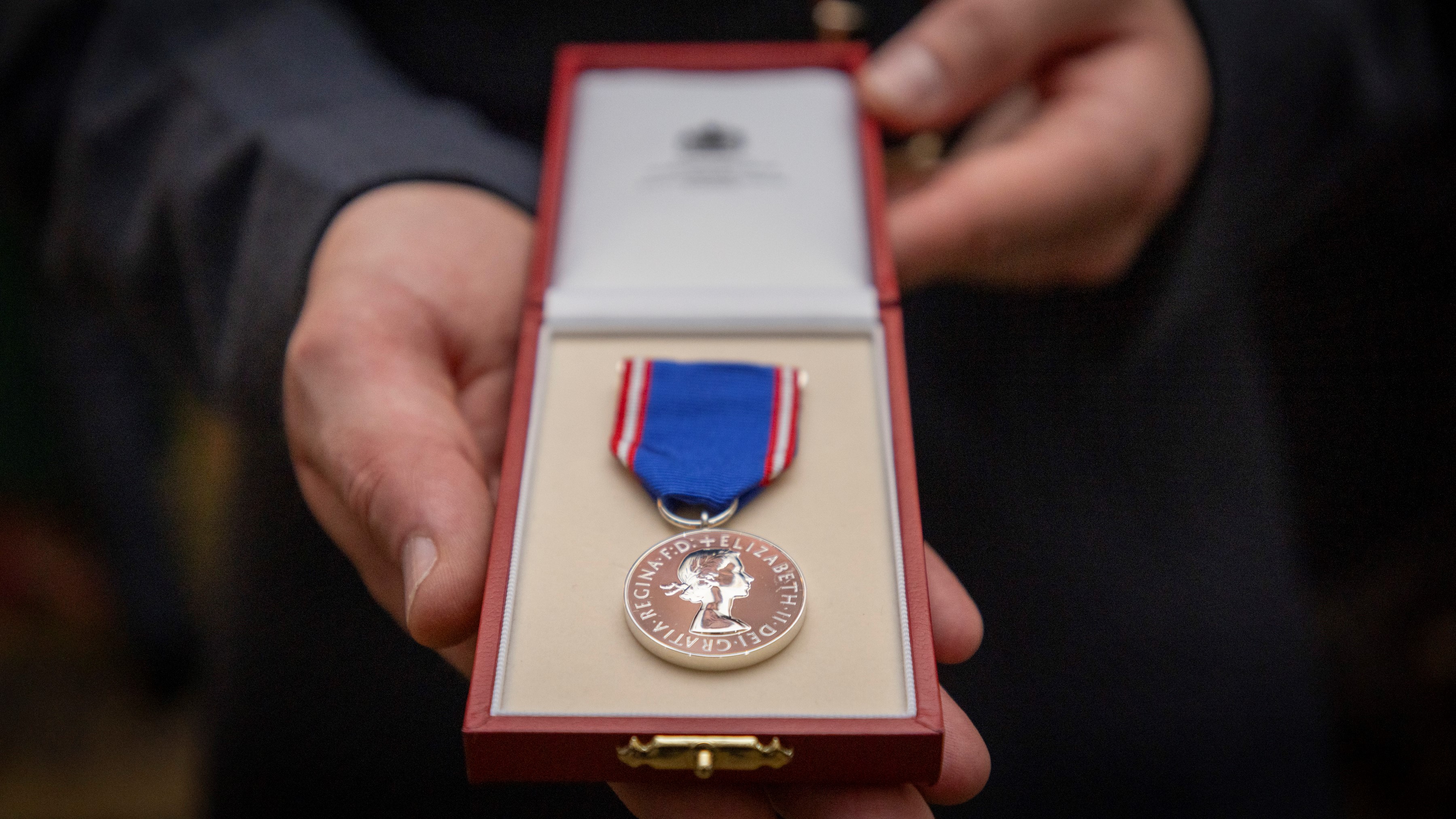 King presents medals to RAF personnel for their role in late Queen's ...
