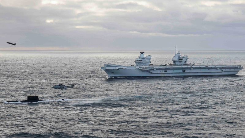 HMS Queen Elizabeth fends off submarine 'attack' during exercise with ...
