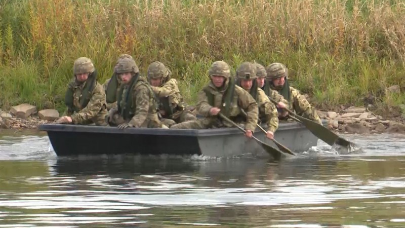 British Troops Show Off Amphibious Skills In River Crossing