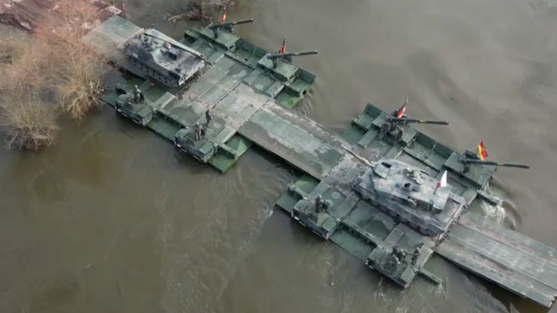 Water under the bridge, but tanks over as Nato engineers put river ...