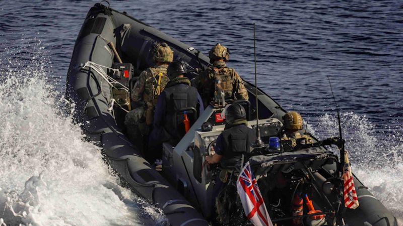 Royal Marines snipers shoot out engines to bring drug-runners' boat to ...