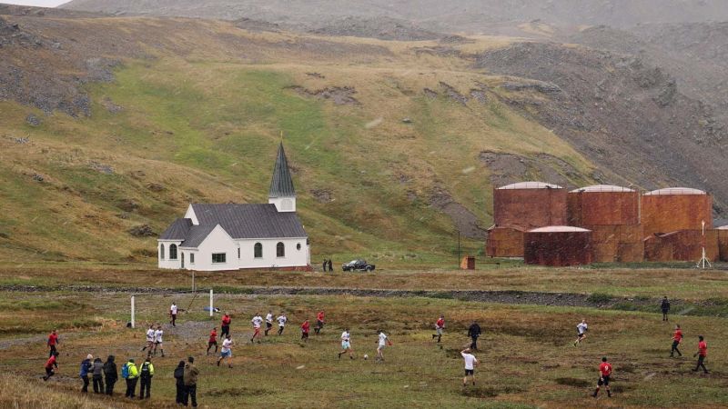 Royal Navy crew go head to head on the 'world's worst' football pitch